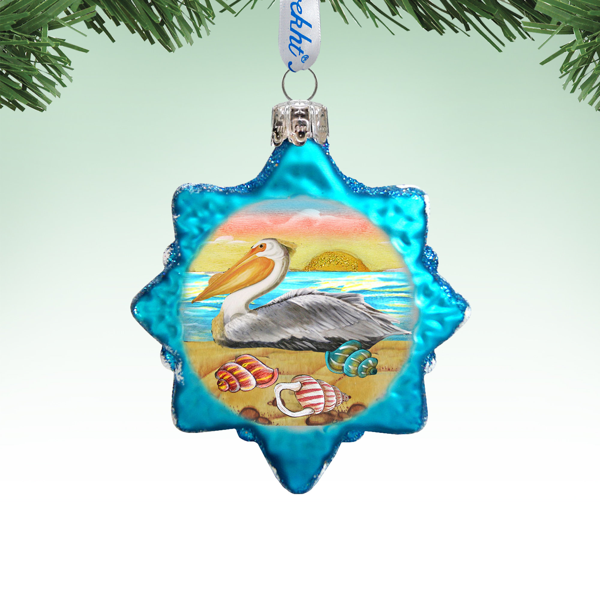 The Holiday Aisle® Pelican Star Coastal Glass Ornament | Wayfair