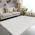 Everly Quinn Jeremial Handmade Shag Faux Sheepskin Area Rug in White ...