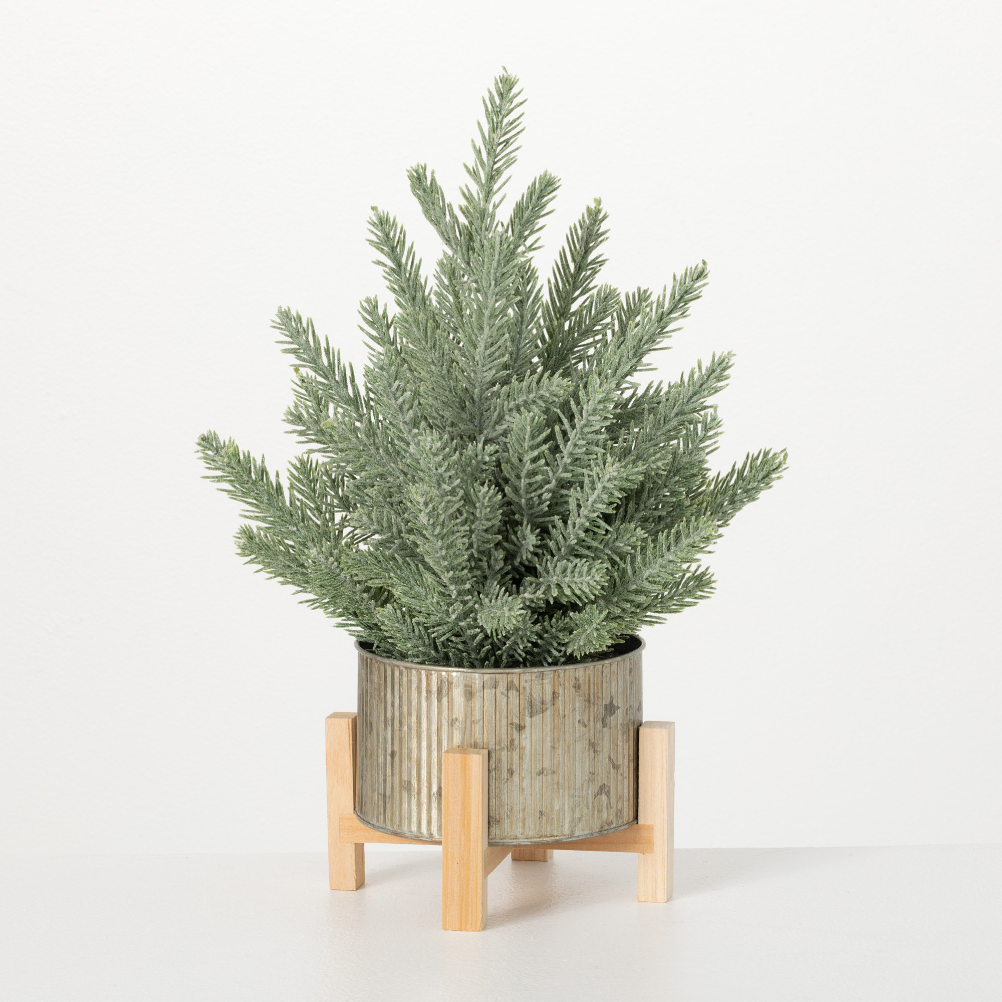 The Holiday Aisle® Evergreen Tree in Raised Pot | Wayfair